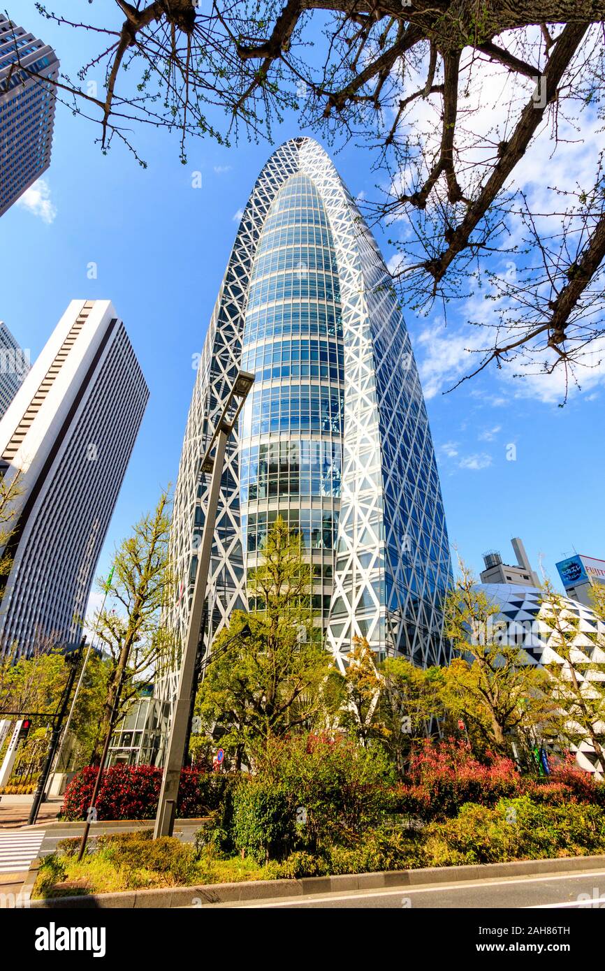 Looking up at the Mode Gakuen Cocoon Tower, also called the Giant Cocoon, with other high rise ...
