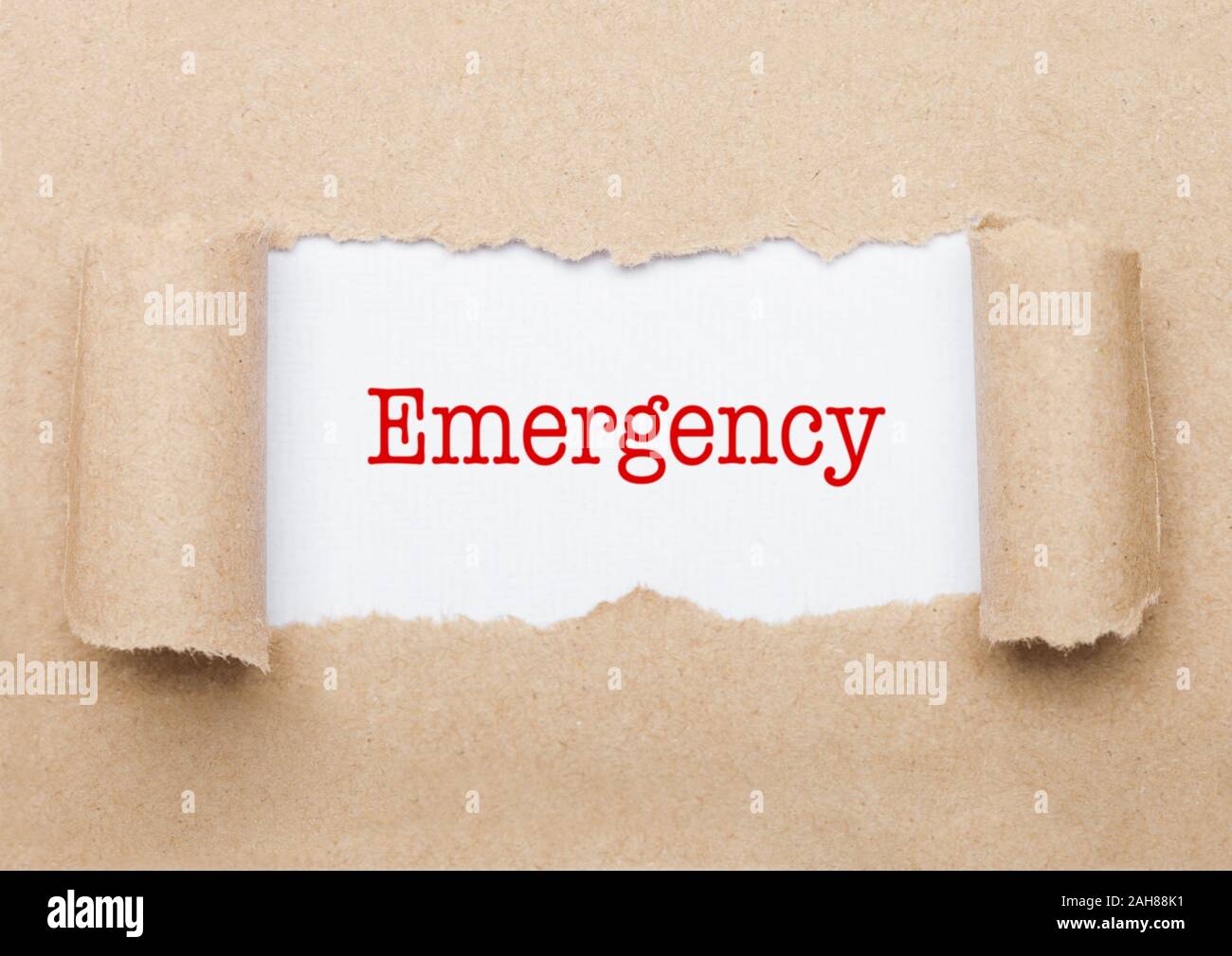 Emergency concept text appearing behind torn brown paper envelope Stock ...