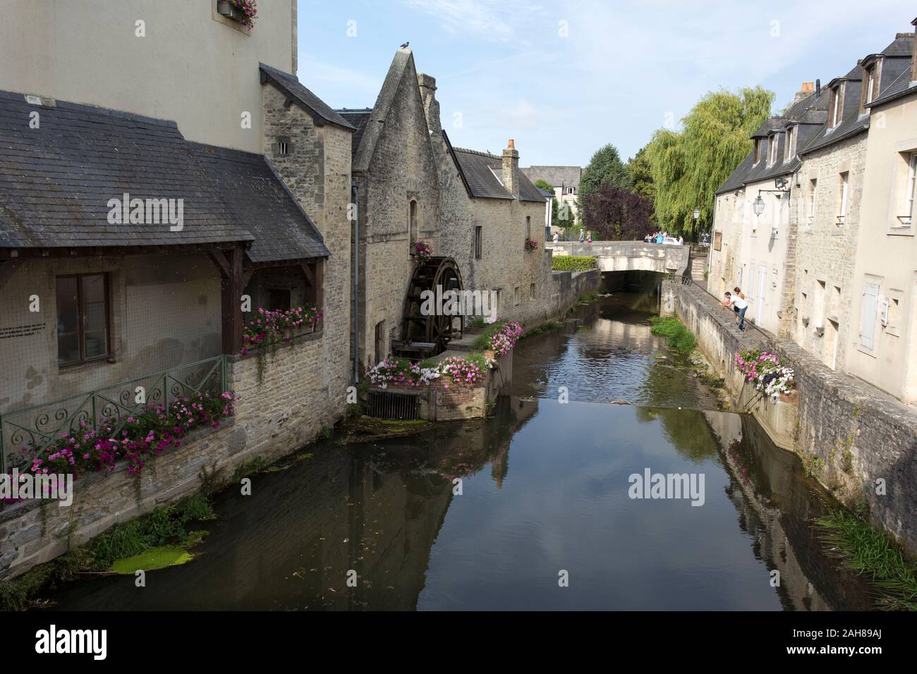 Bayeux, France - August 14, 2016: Water mill and Aure River in the old ...