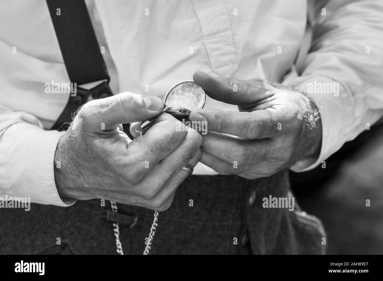 Man hand in watch Black and White Stock Photos & Images - Alamy