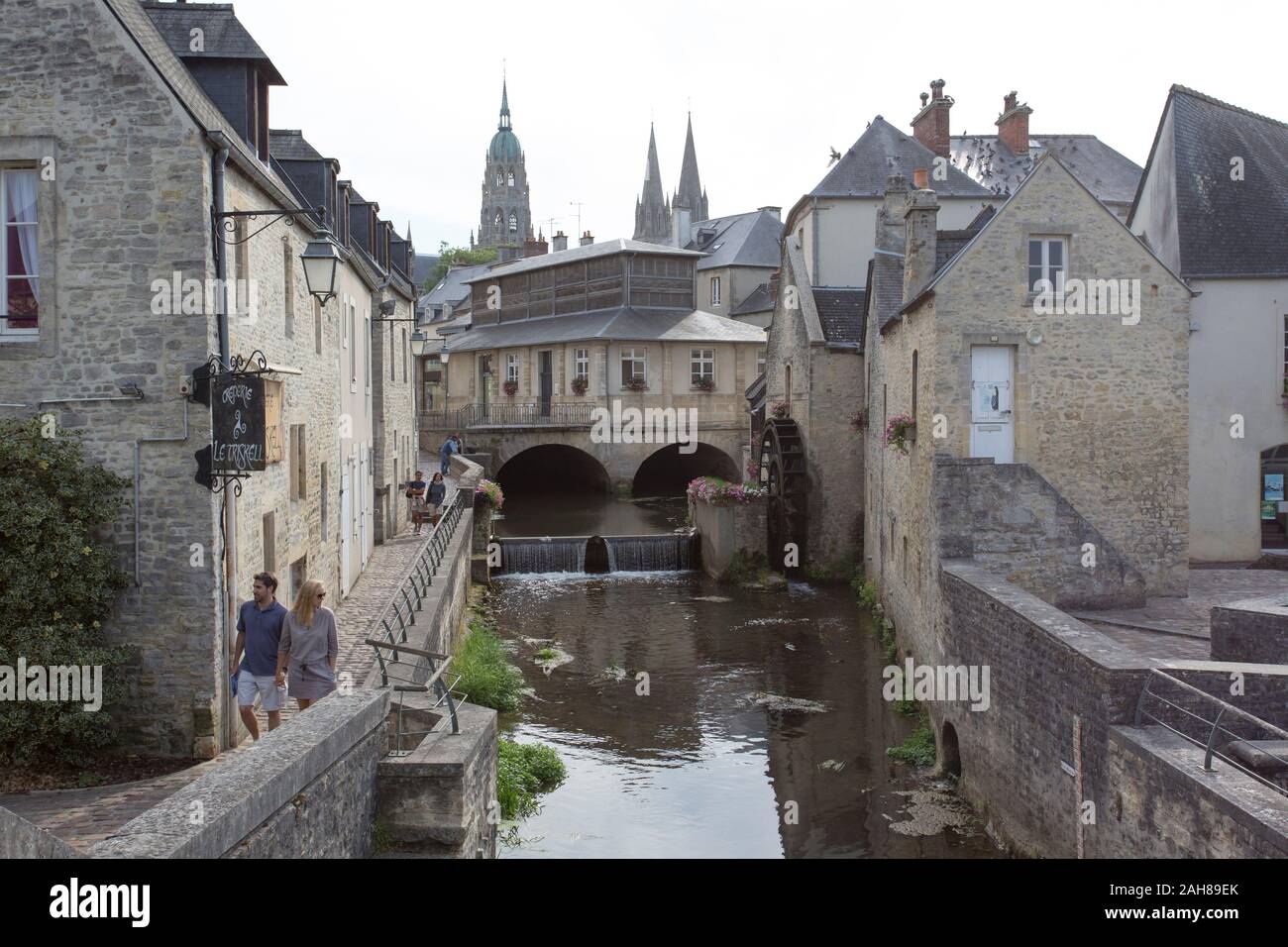 Bayeux, France - August 14, 2016: Water mill and Aure River in the old ...