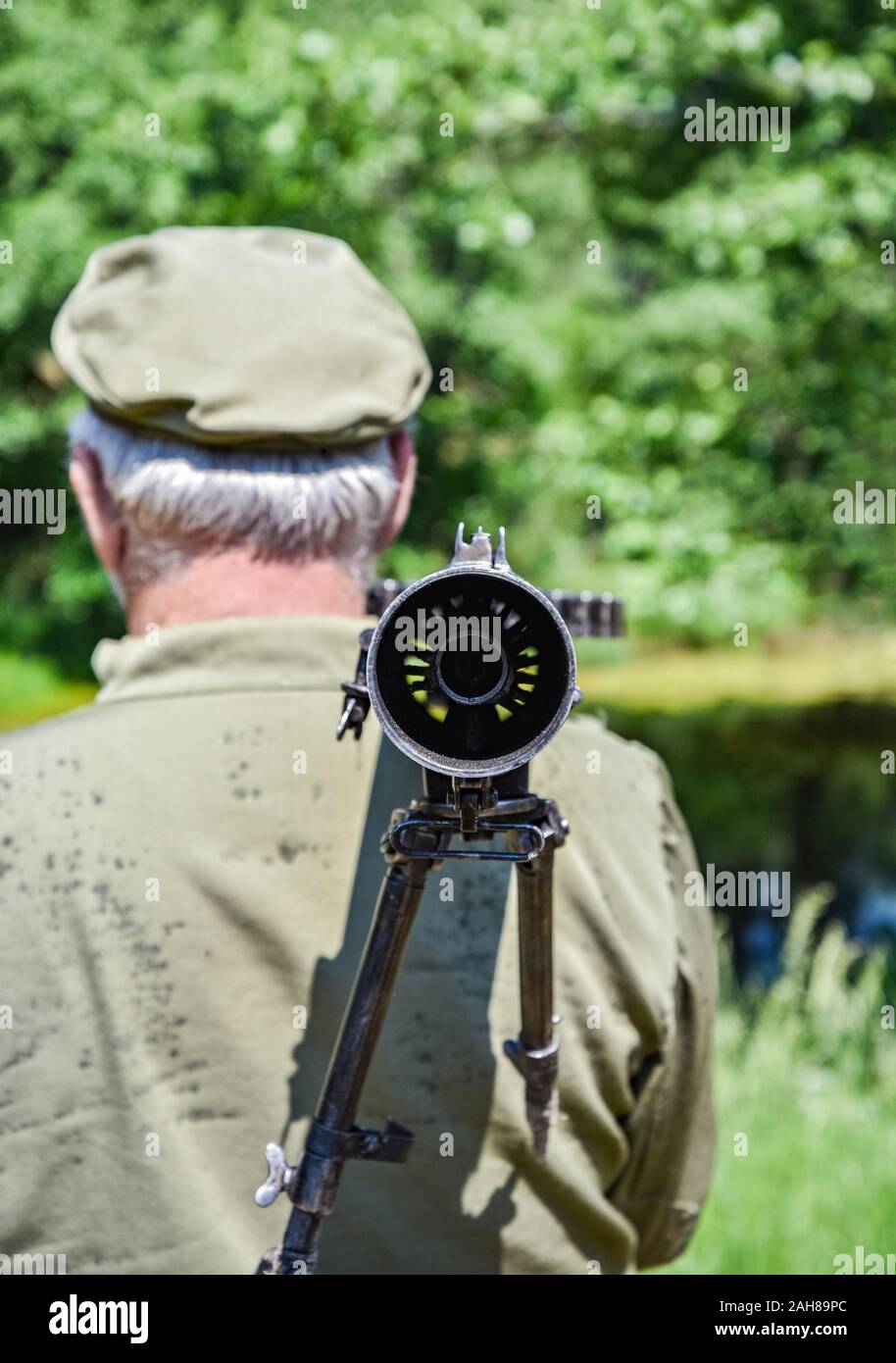 Holding machine gun hi-res stock photography and images - Alamy
