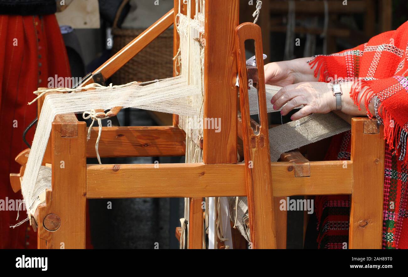 Hands of a woman who weaves on a loom Stock Photo - Alamy