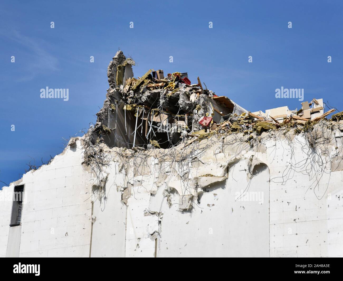Dismantling of a destroyed house Stock Photo - Alamy