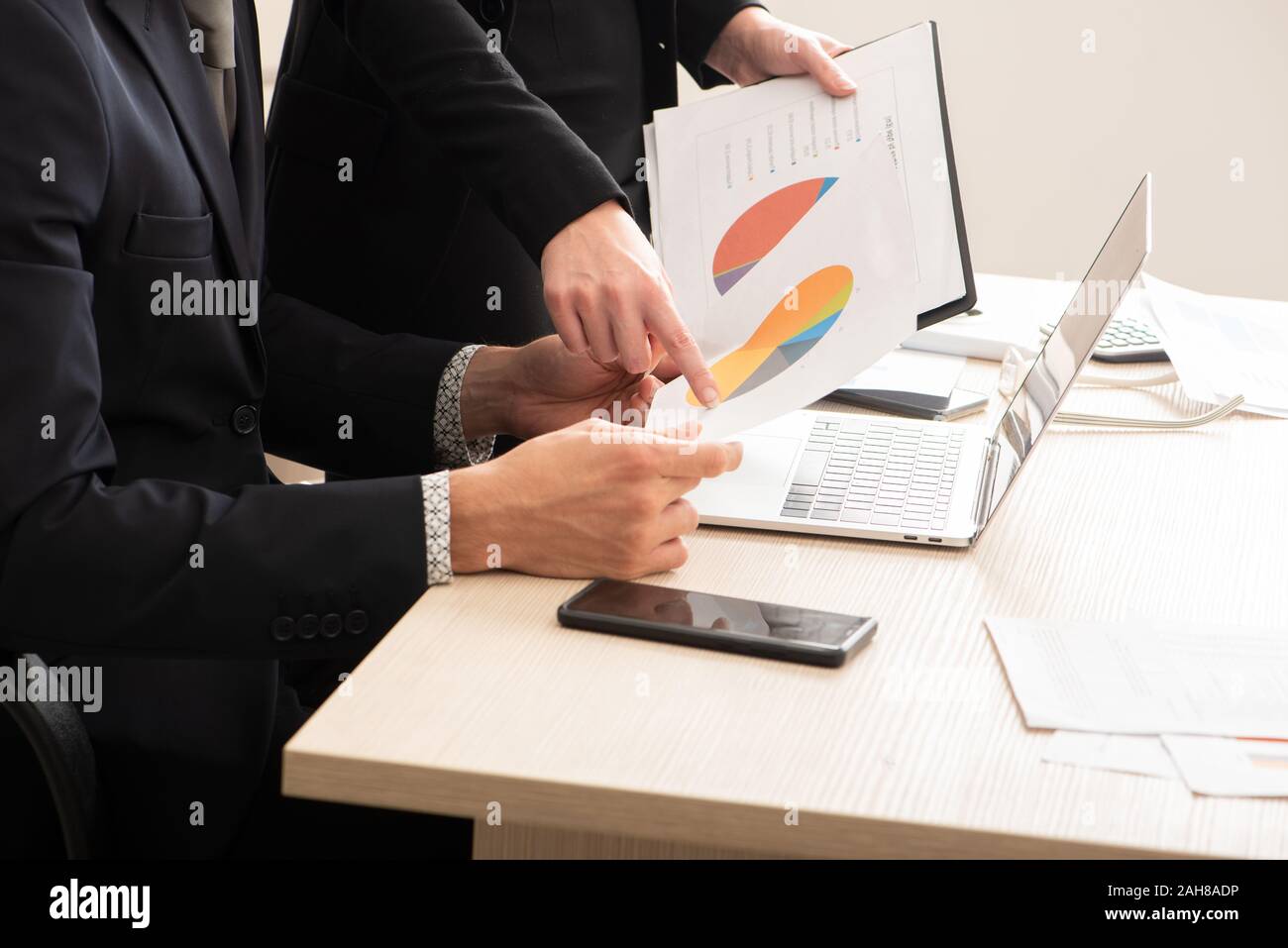 Business people discussing financial plan close up Stock Photo - Alamy