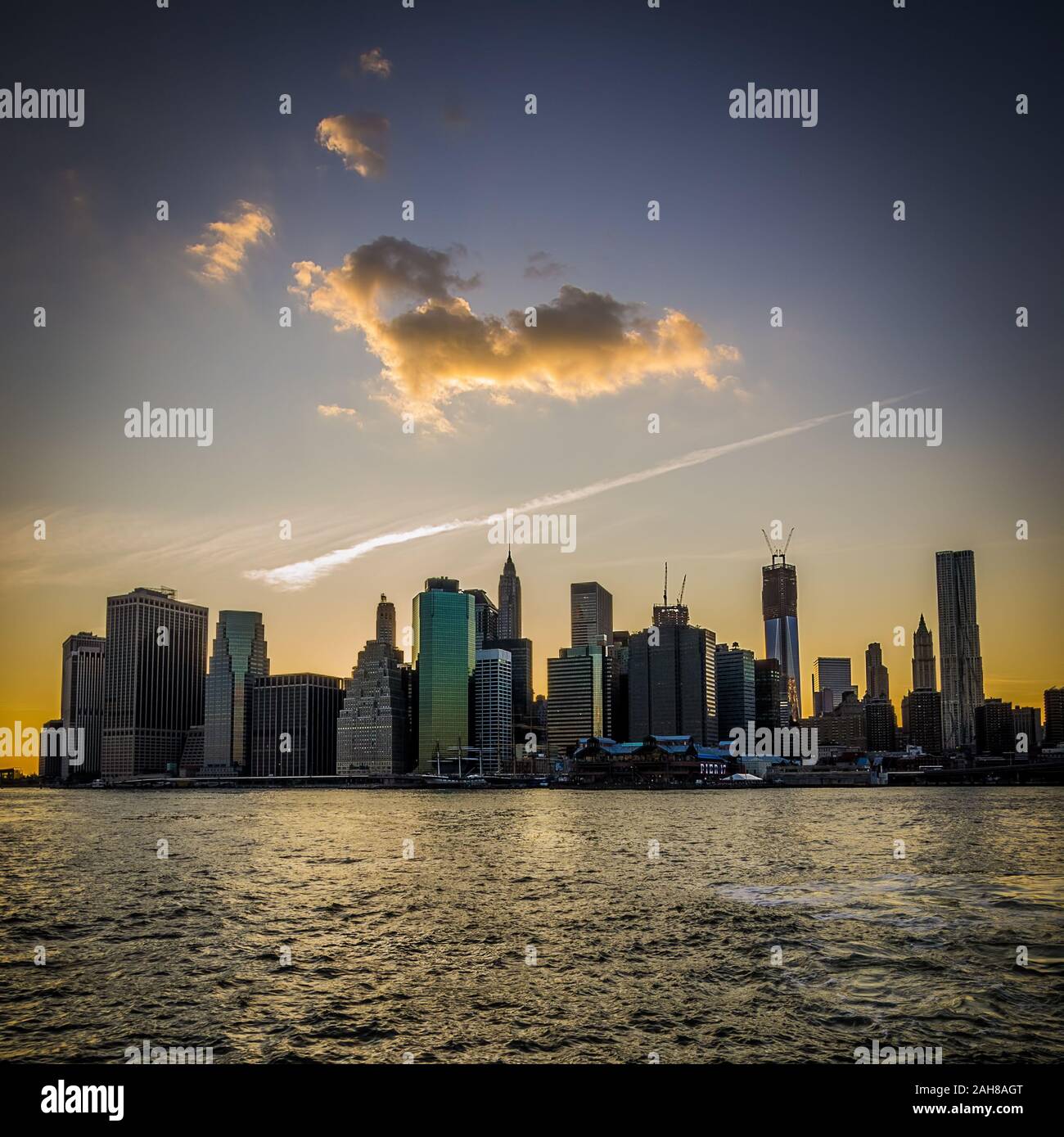 Iconic cityscape of Manhattan at sunset as seen from Brooklyn Heights ...