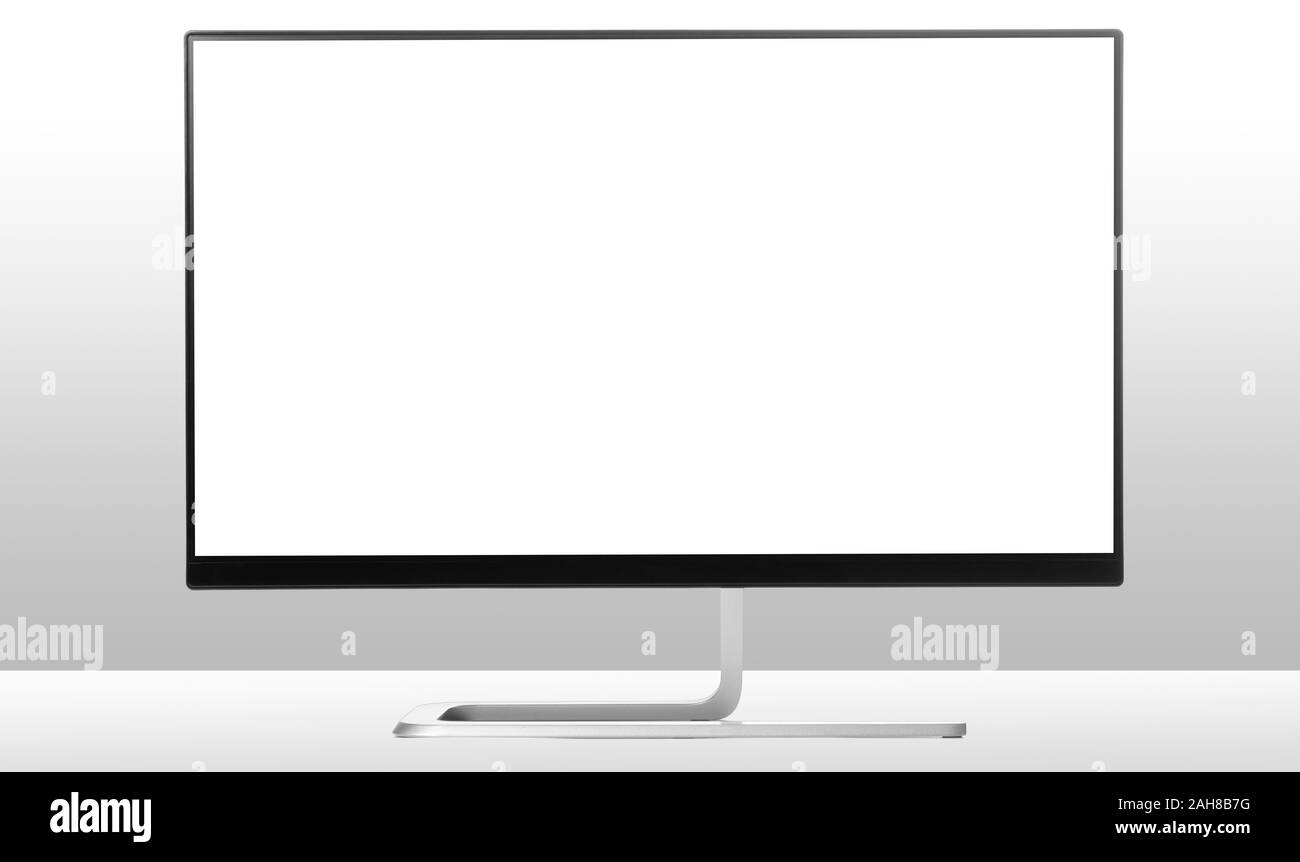Modern monitor on white table and light background Stock Photo - Alamy