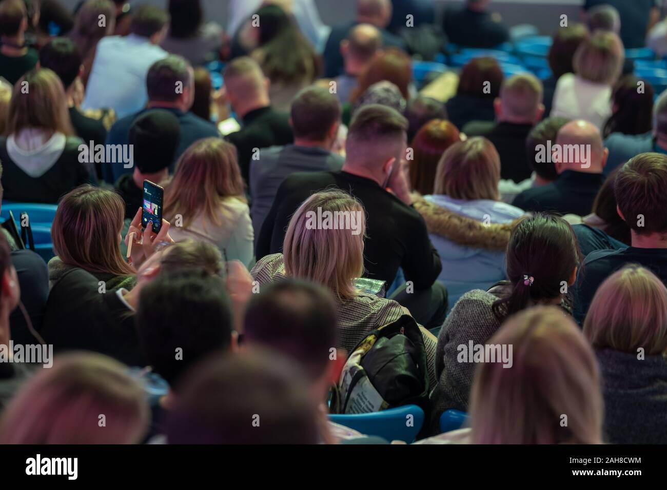Business conference attendees sit and listen Stock Photo - Alamy