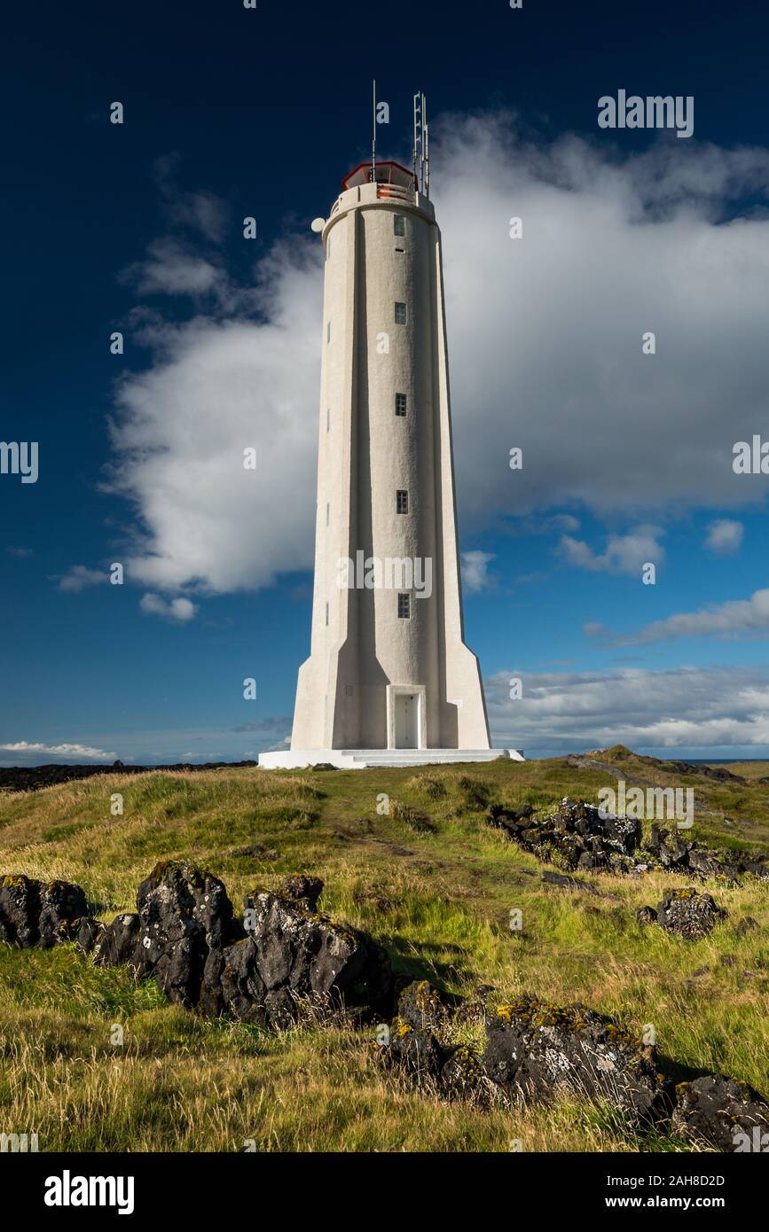 Close up of a futuristic icelandic lighthouse against a blue sky with ...