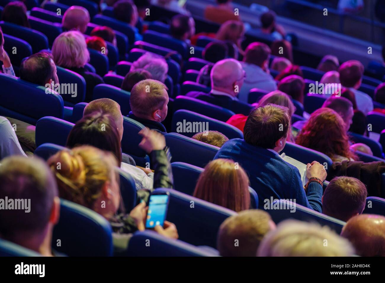 Business conference attendees sit and listen Stock Photo - Alamy