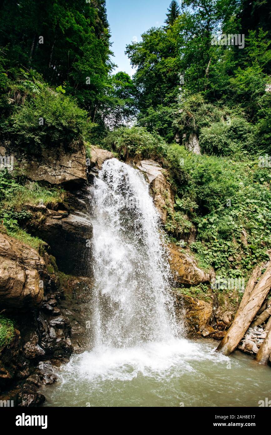 A small waterfall in the Park. Beautiful weather and view of the ...