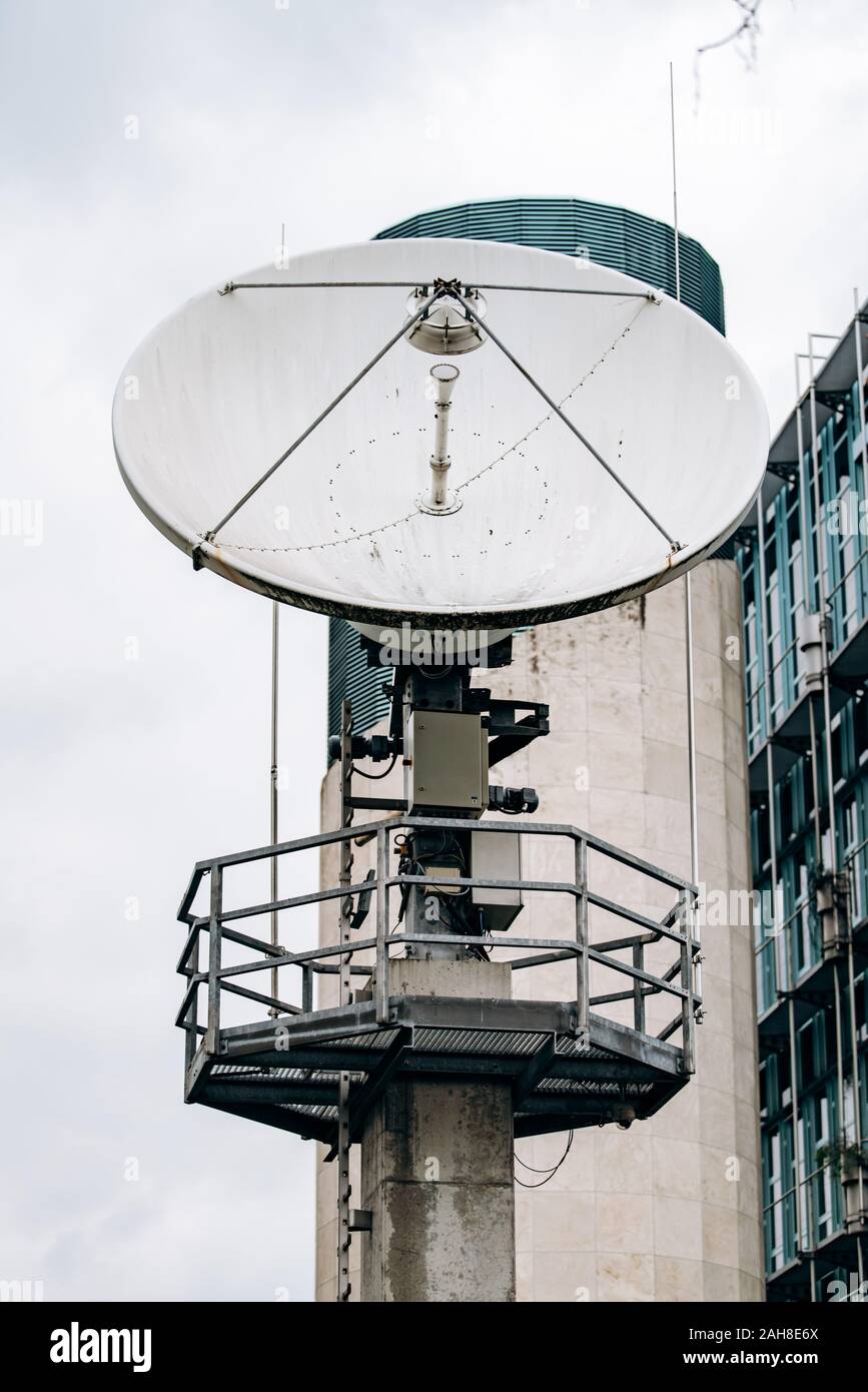 Parabolic satellite dish on the background of the building Stock Photo ...