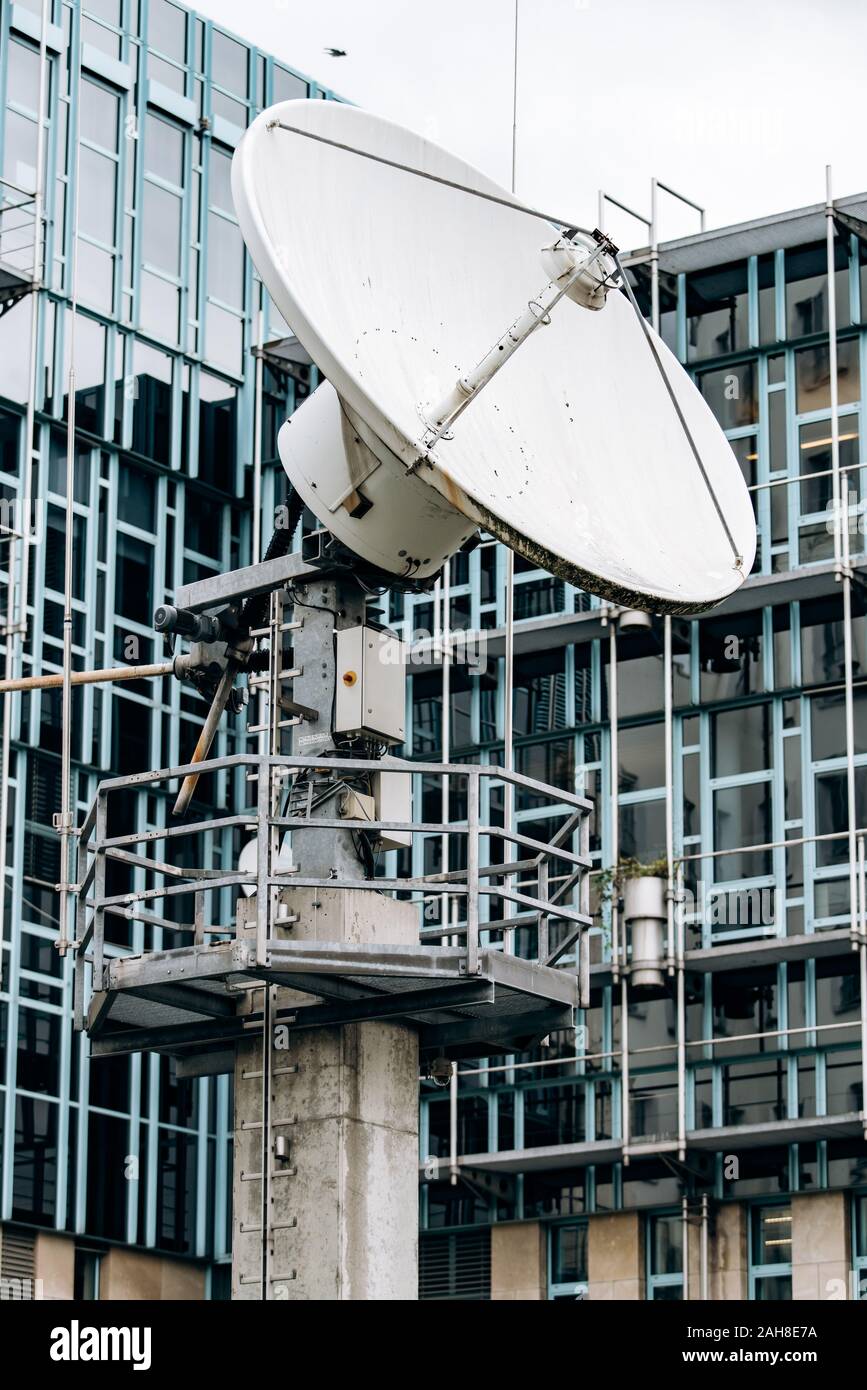 Parabolic satellite dish on the background of the building Stock Photo ...