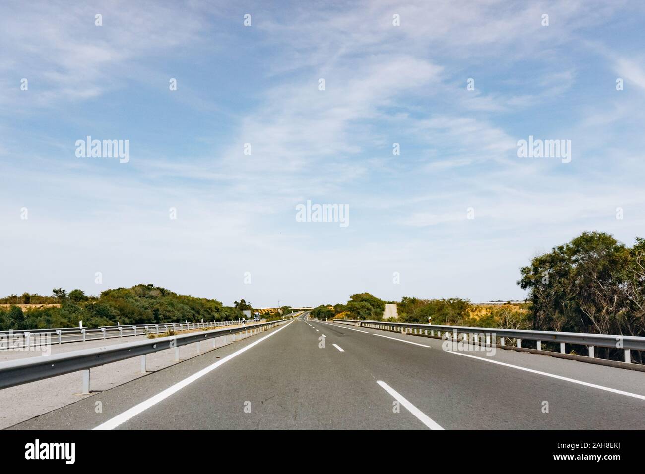 Paved road and beautiful green landscape in summer Stock Photo - Alamy