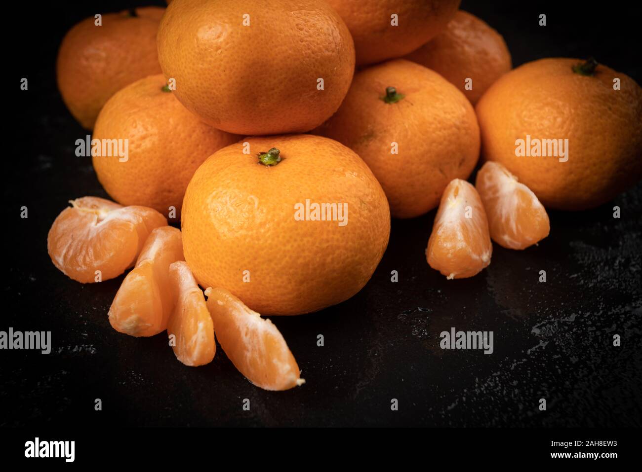 Juicy mandarin on black background. Mandarin Fruit Stock Photo - Alamy