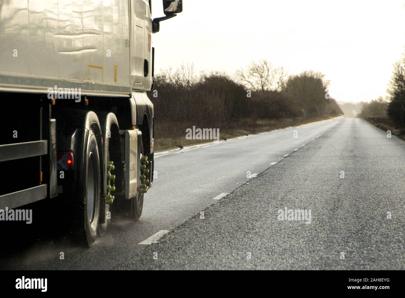 A large HGV travels across country to deliver or collect goods for the ...
