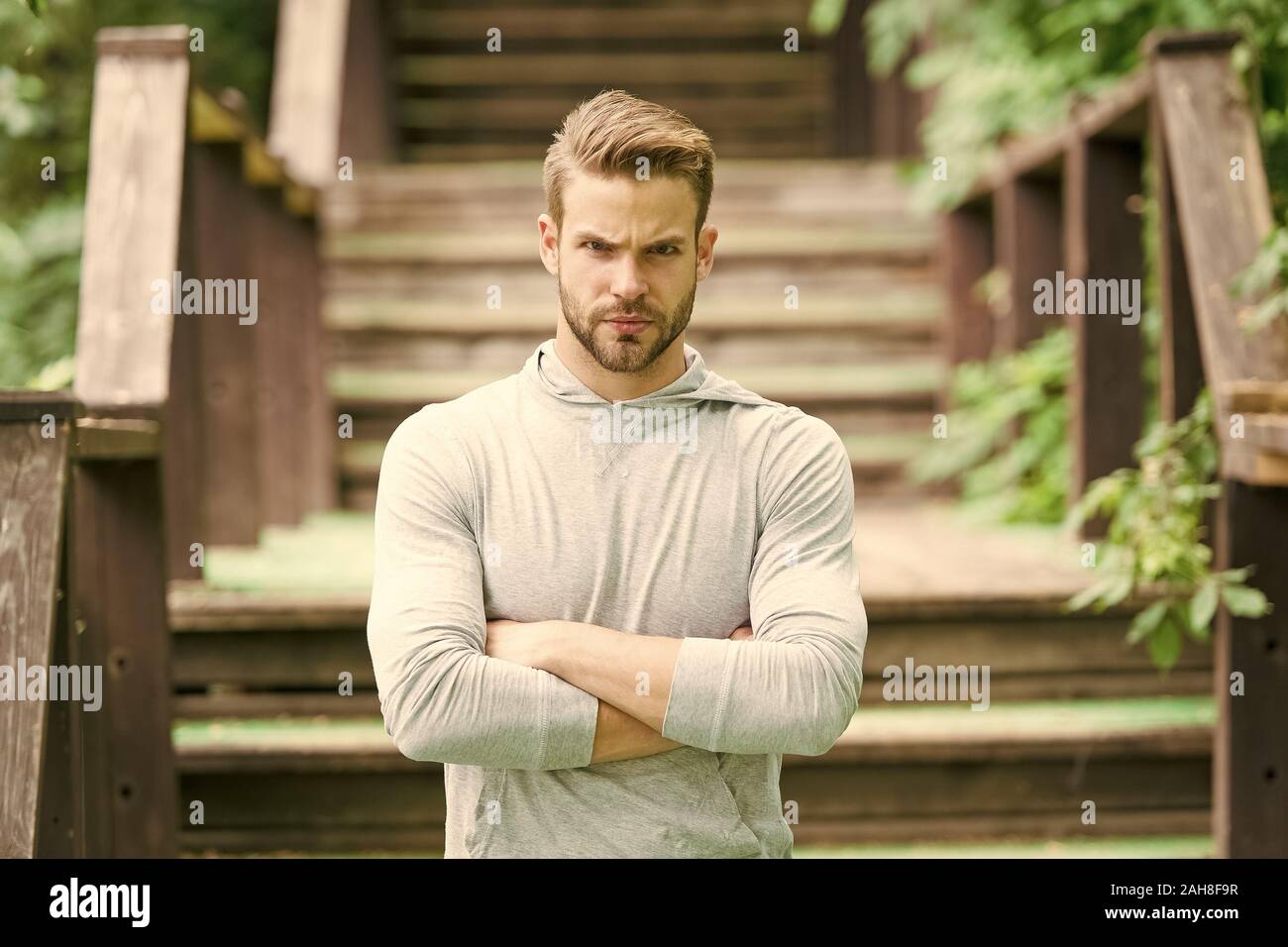 Overcome any obstacles. Sportsman lifestyle. Handsome athlete stairs ...