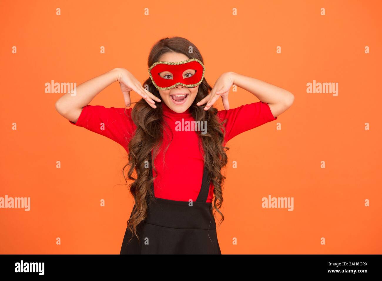 Kid wear eye mask. Girl wear mask orange background. Event and ...
