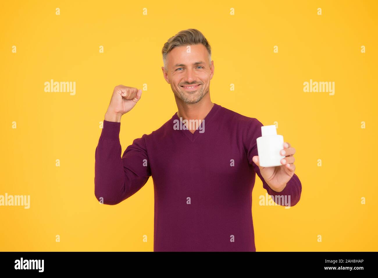 Smell good all day. Happy guy hold cologne bottle. Personal hygiene ...