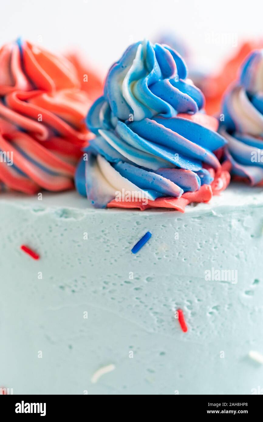 Red, white, and blue round vanilla cake with buttercream frosting for ...