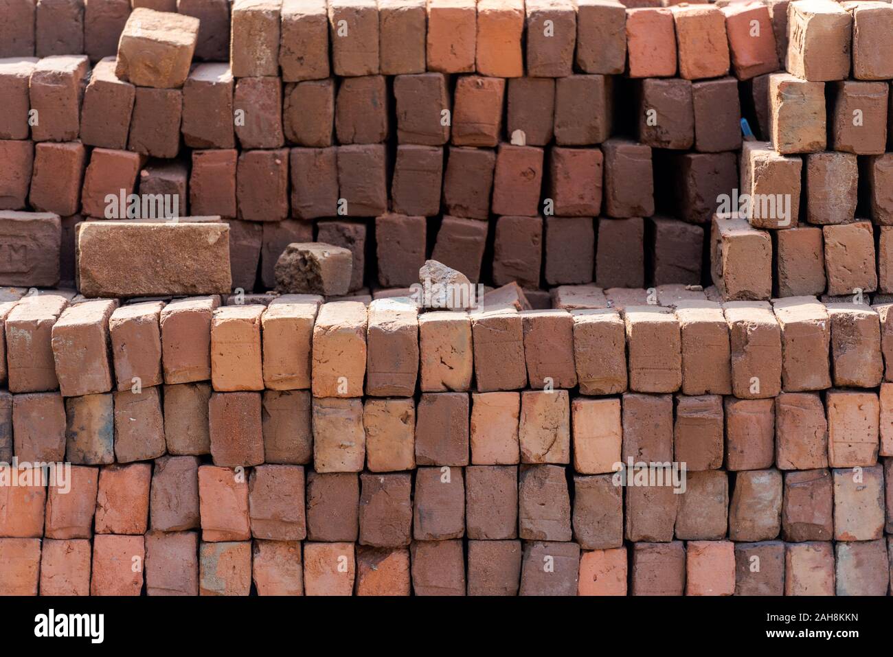 Stacked red bricks ready to use for construction Stock Photo - Alamy