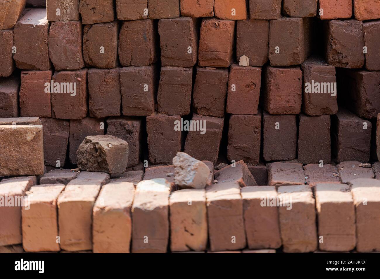 Stacked red bricks ready to use for construction Stock Photo - Alamy