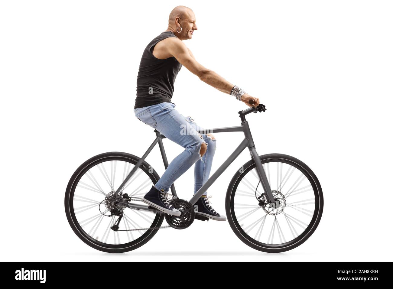 Full length profile shot of a bald guy riding a bicycle isolated on ...