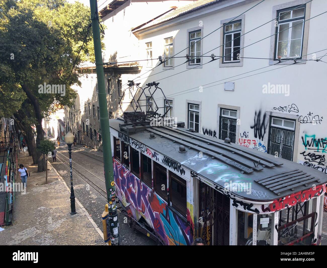 Cable car with graffiti on the street, LIsbon, Portugal Stock Photo - Alamy