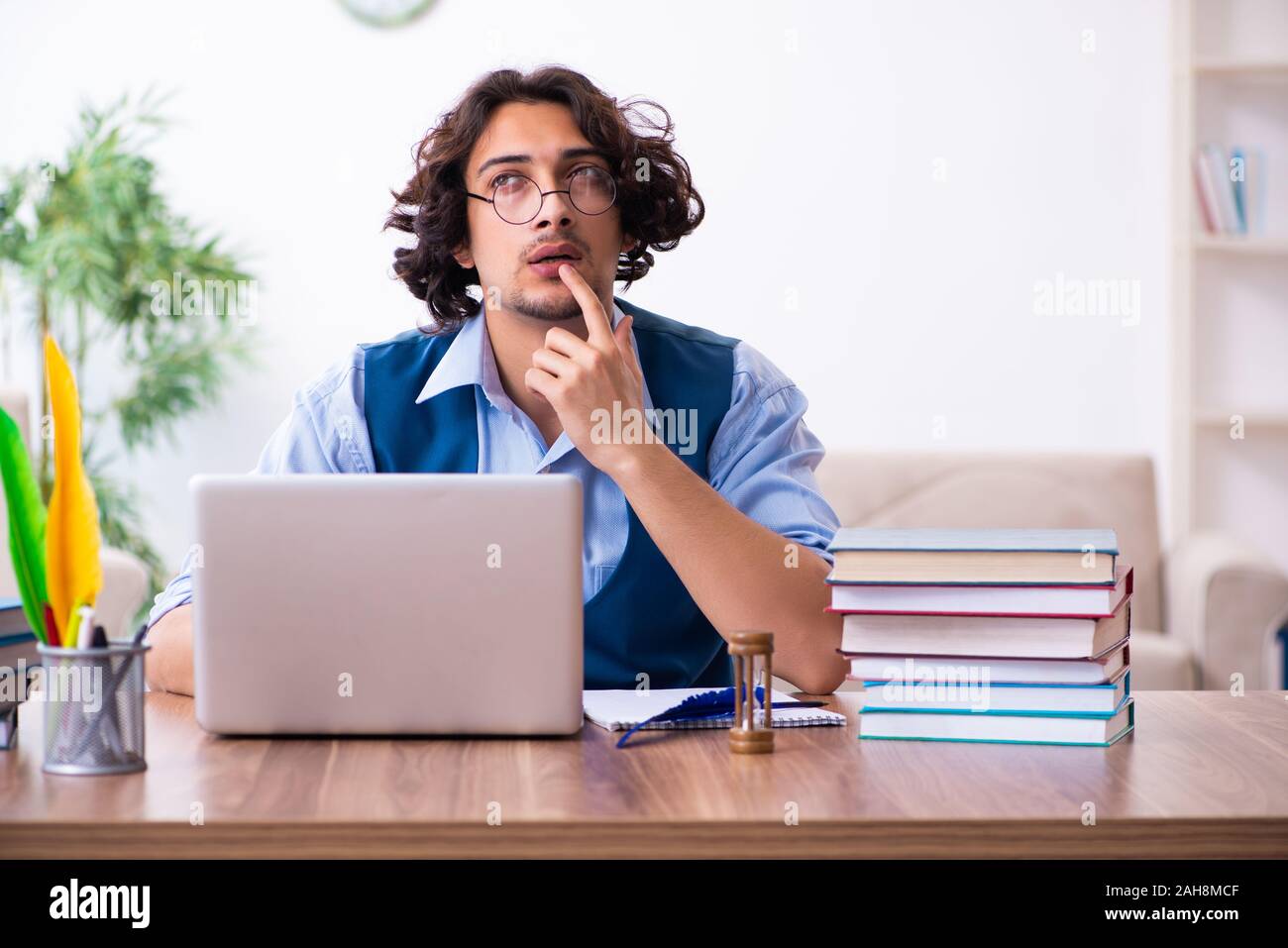 The young writer working on his new work Stock Photo - Alamy