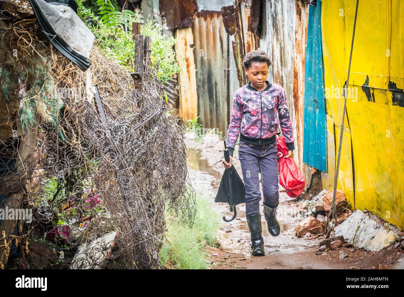 Johannesburg, South Africa - December 4, 2019 - a girl walks in the ...