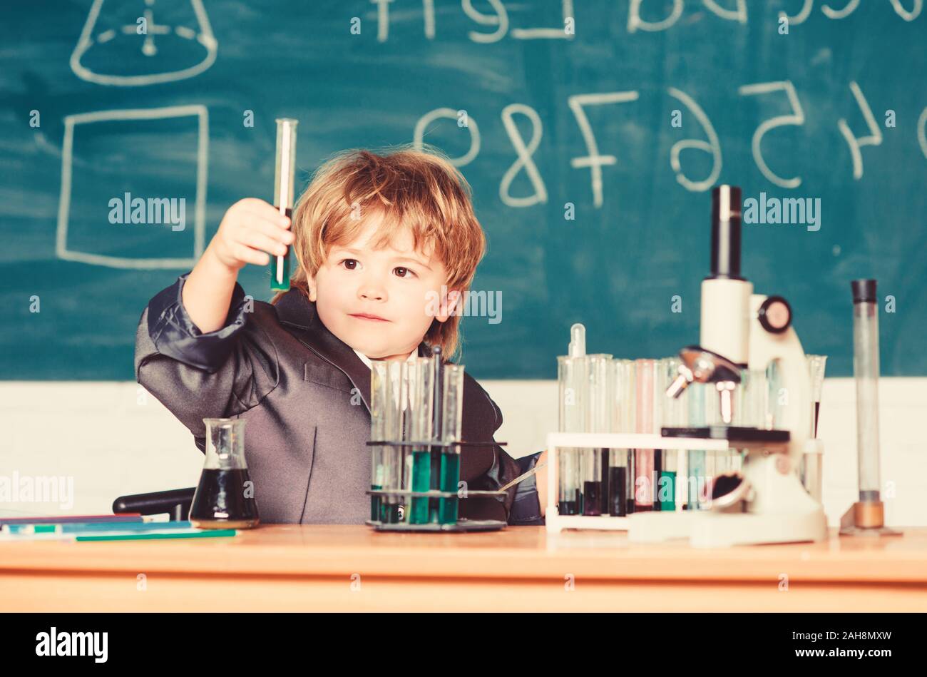 Kid study biology chemistry. Boy microscope and test tubes school ...