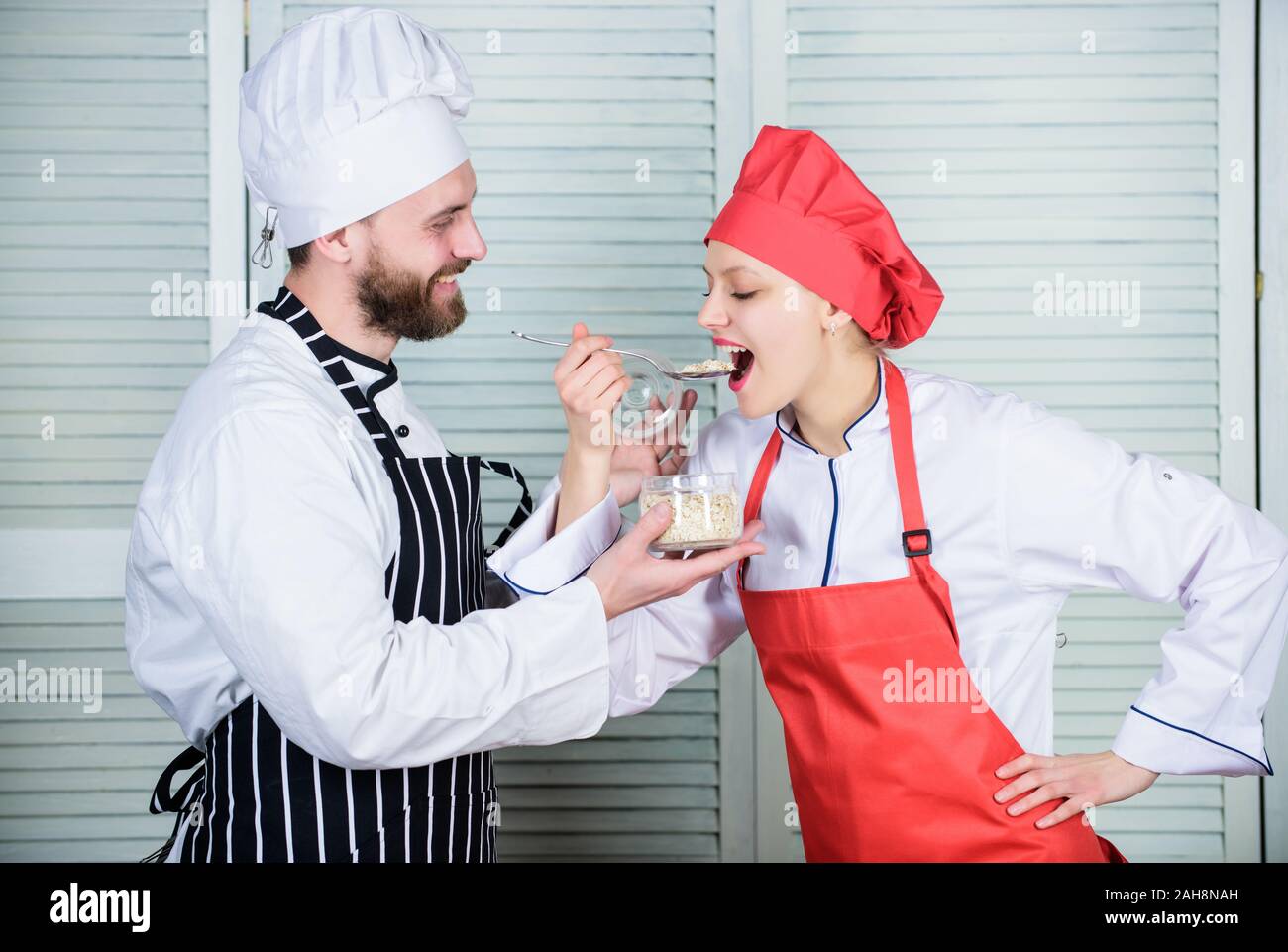 Couple compete in culinary. Try ingredients before cook. Estimate taste ...