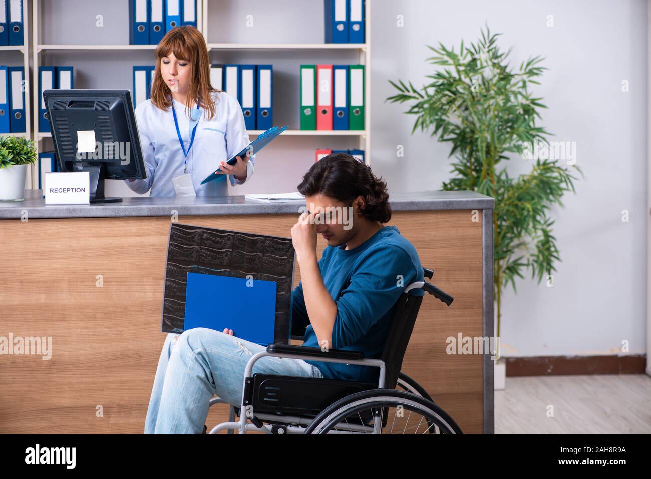 The young patient at the reception in the hospital Stock Photo - Alamy