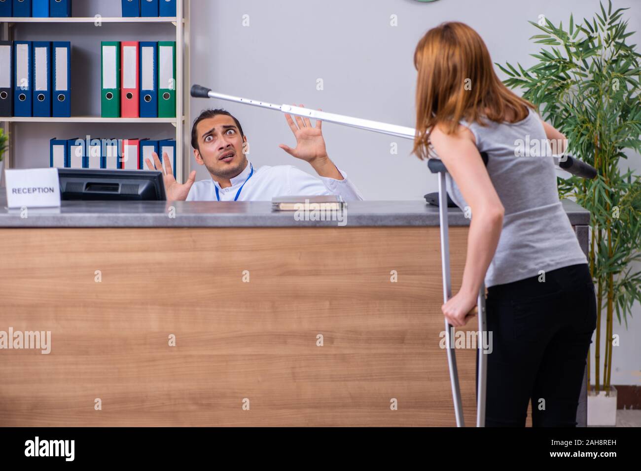 The young patient at the reception in the hospital Stock Photo - Alamy