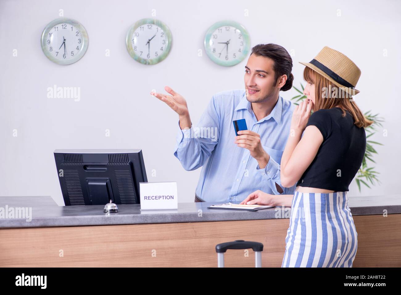 The young woman at hotel reception Stock Photo - Alamy