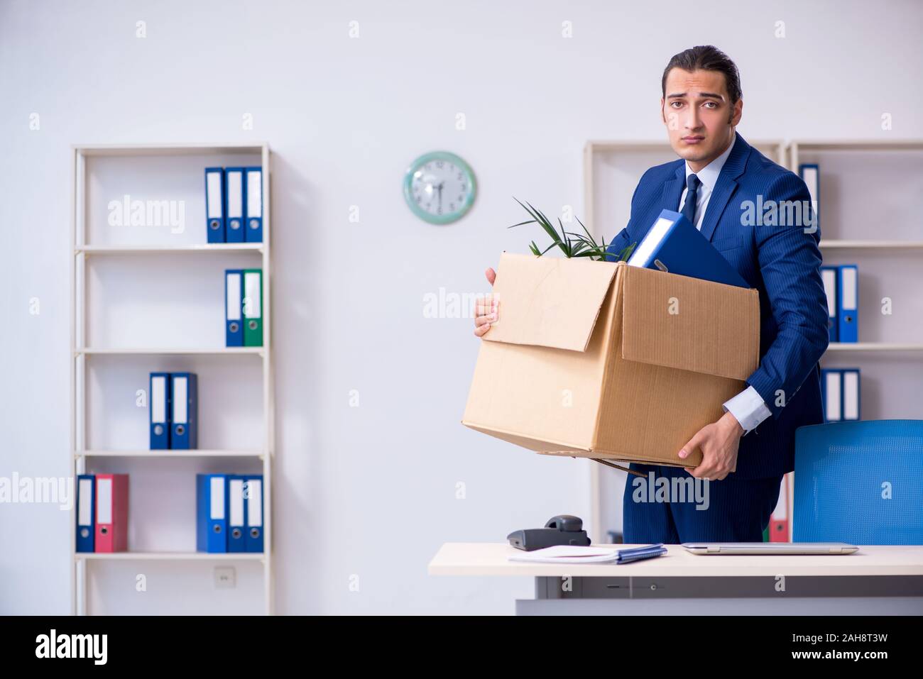 The young employee being made redundant Stock Photo - Alamy