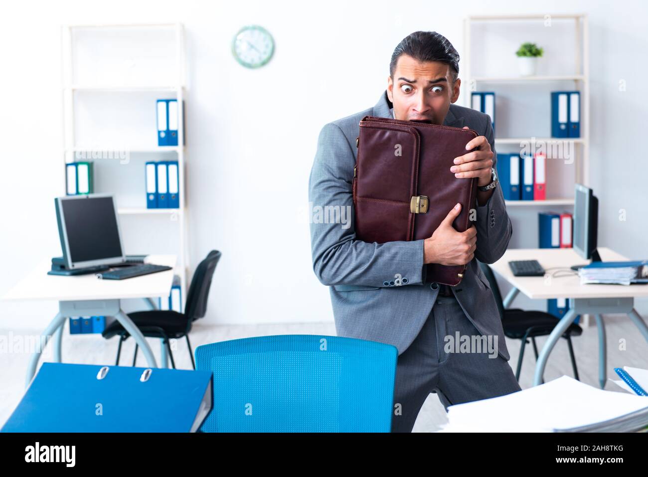 The businessman with heavy paperwork workload Stock Photo - Alamy
