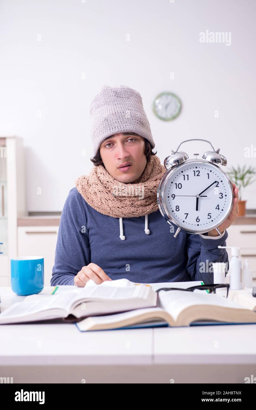 The sick male student suffering at home Stock Photo - Alamy