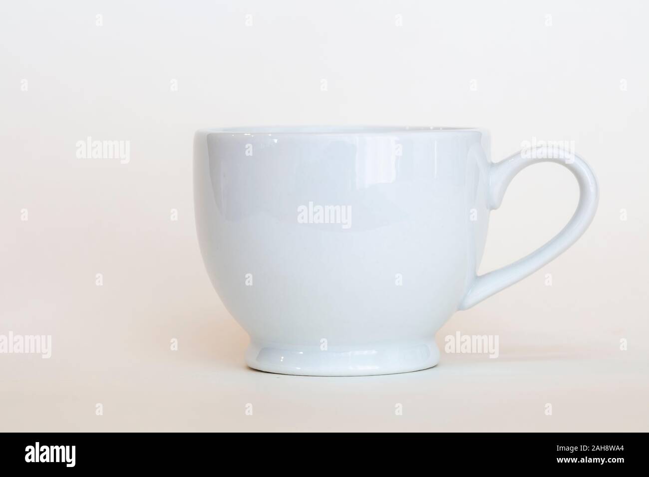 Isolated ceramic white cup with handle Stock Photo - Alamy