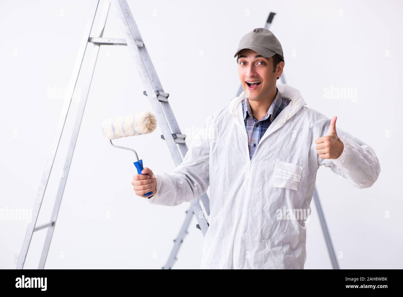 Painter working at the construction site Stock Photo - Alamy