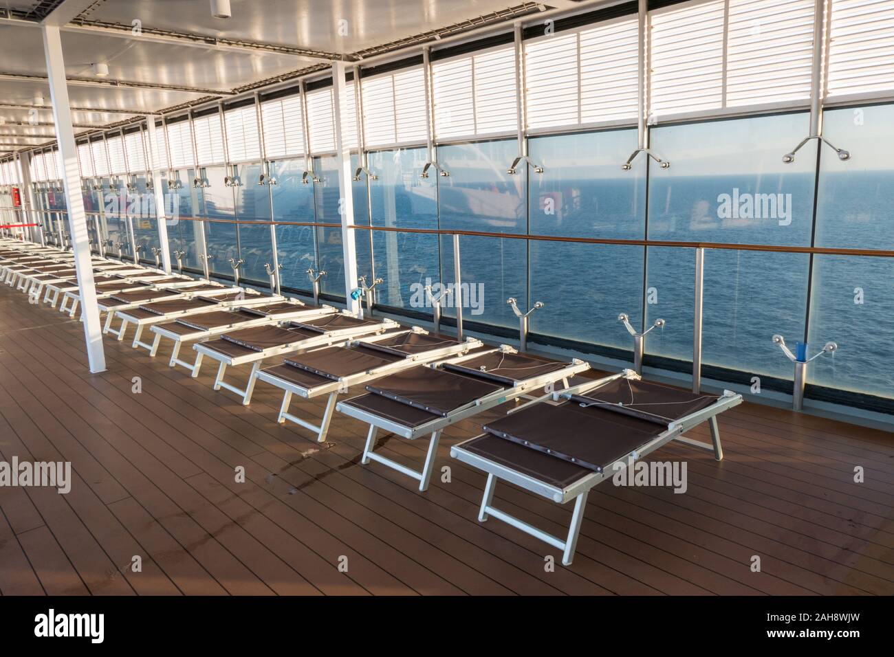 Folding chairs on the cruise ship MSC Lirica Stock Photo - Alamy