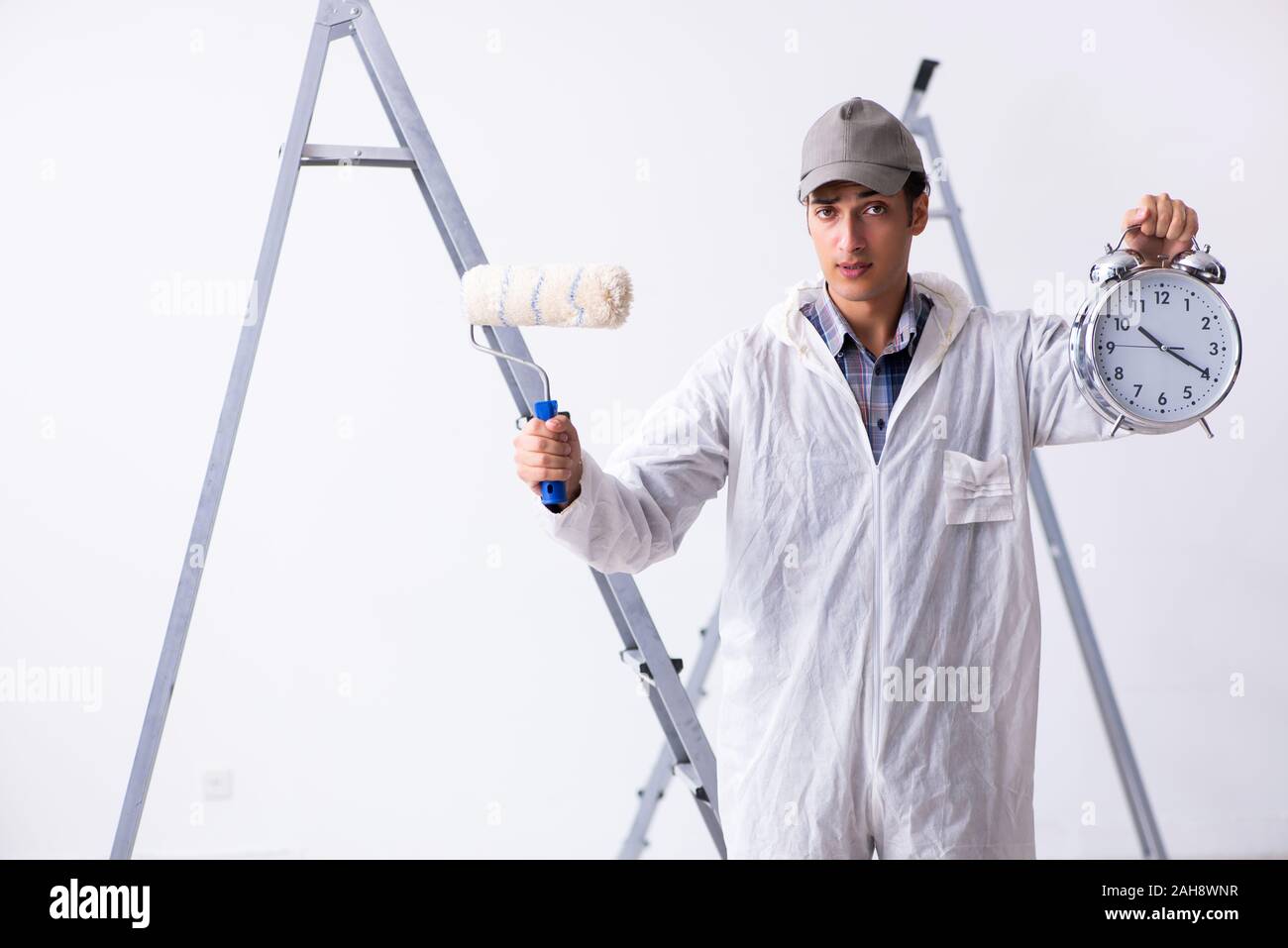 Painter working at the construction site Stock Photo - Alamy