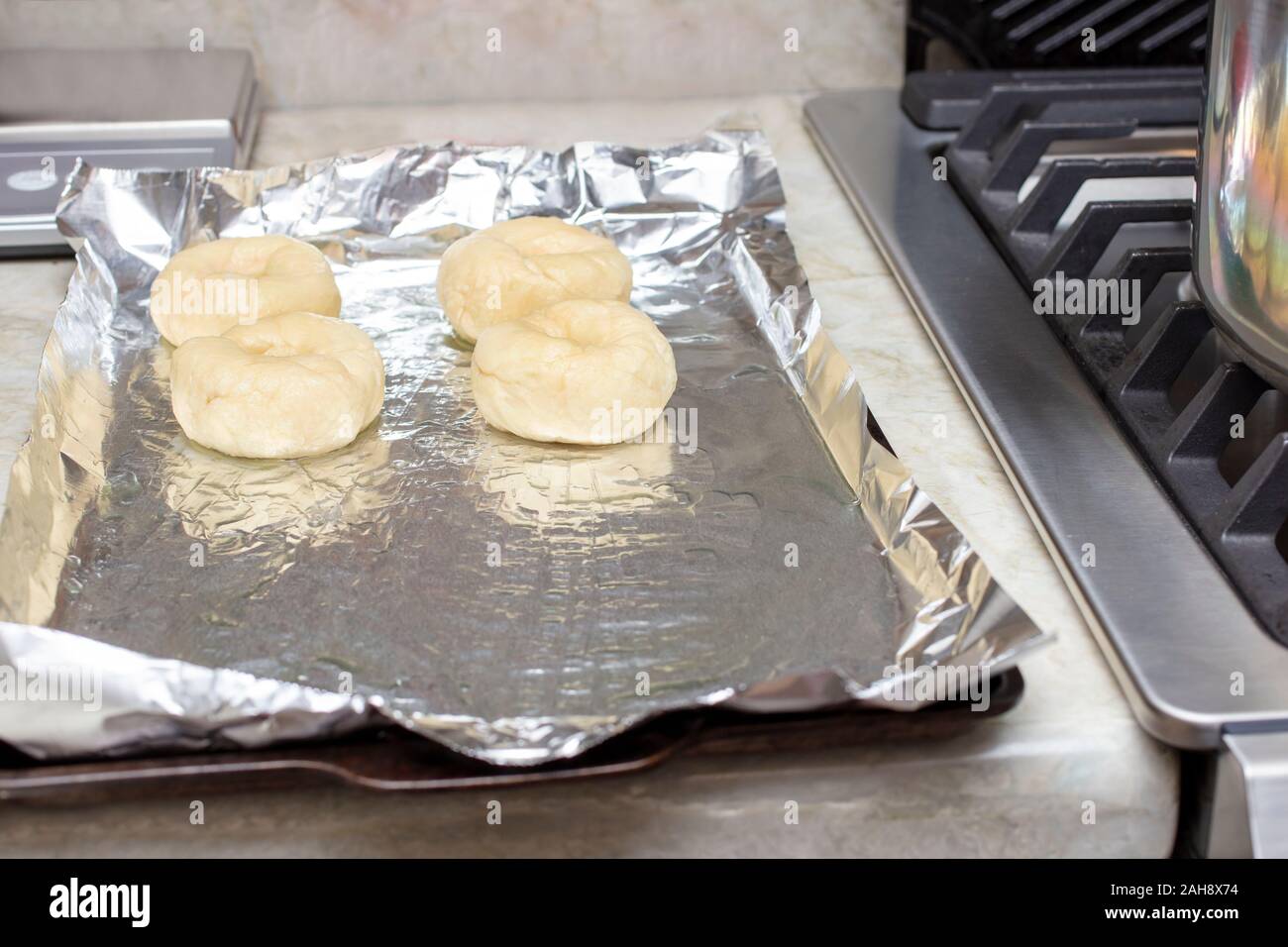 Homemade process for making bagels and preparing them for oven baking ...