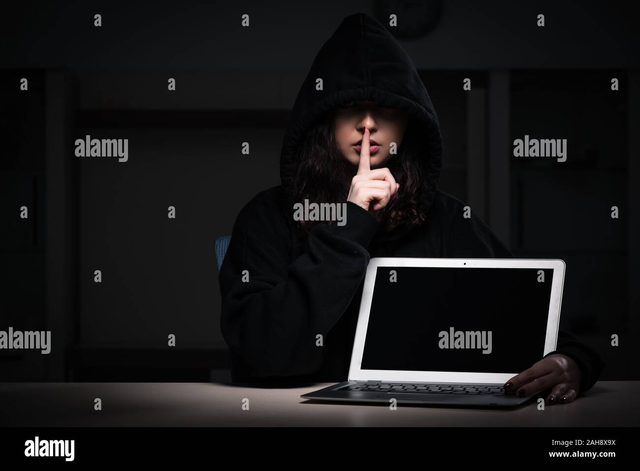 The female hacker hacking security firewall late in office Stock Photo ...