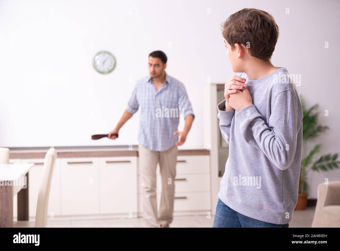Father punishing son hi-res stock photography and images - Alamy