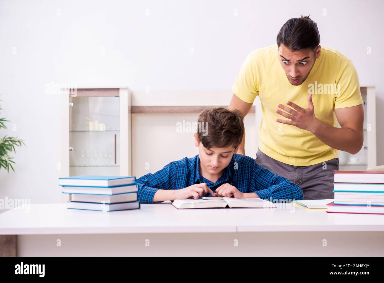 The father helping his son to prepare for school Stock Photo - Alamy