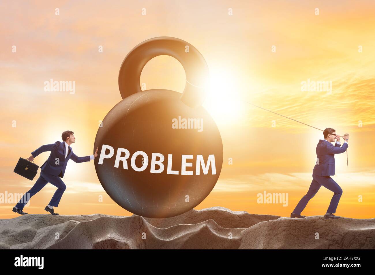 The businessmen trying to deal with difficult problem Stock Photo - Alamy