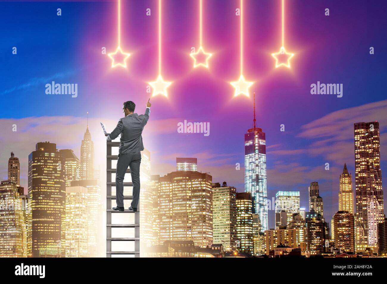 The businessman reaching out for stars Stock Photo - Alamy