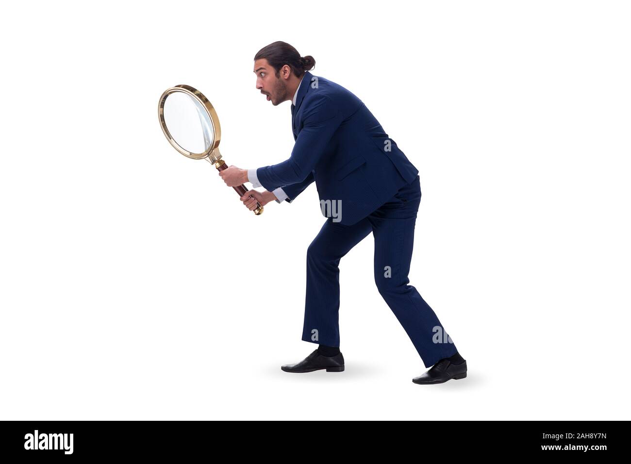 The businessman with giant magnifying glass Stock Photo - Alamy