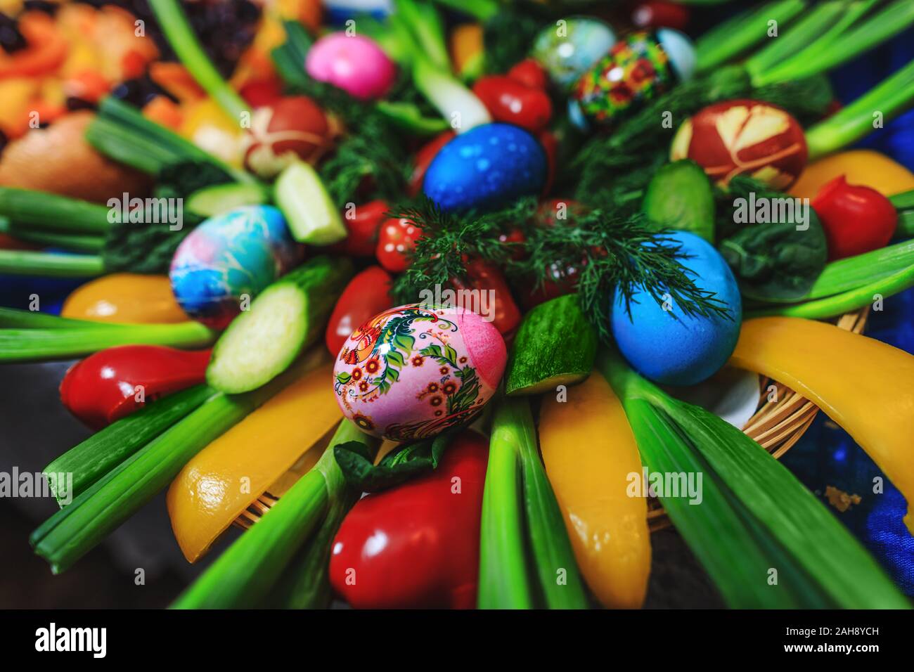 Easter decorated eggs and vegetables flower on holiday homemade table ...